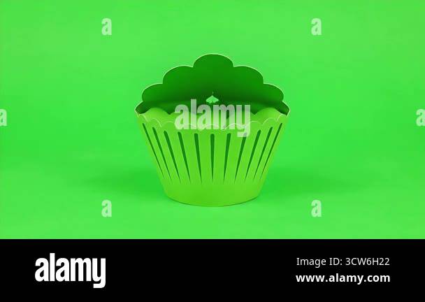 A stop motion animation of a single green paper cupcake liner opening ...