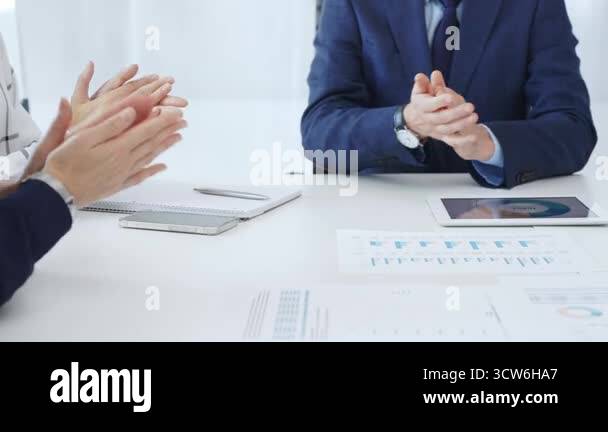 Business people applauding after successful presentation during a ...