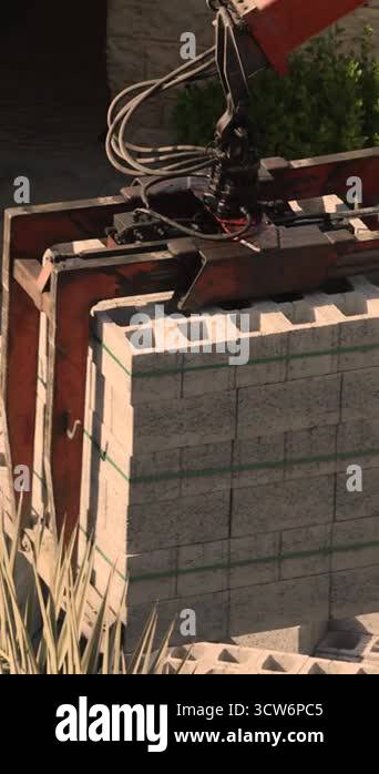 Heavy manipulator crane moving concrete slabs at construction site ...