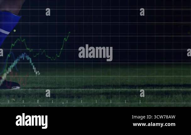 Soccer player kicking ball as grid overlay appears tracking graphs and ...