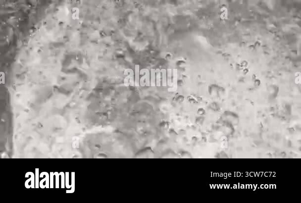 boiling water texture closeup on electric stove, food closeup top view ...