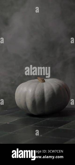 Halloween theme. Light green pumpkin with mystic smoke and orange light in background Stock ...