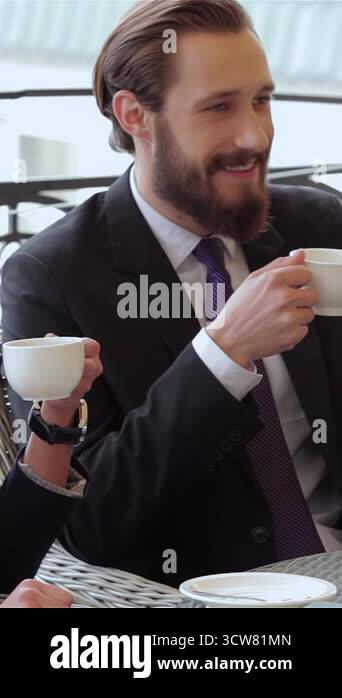 A dynamic duo of business professionals enjoys a lively lunch meeting ...