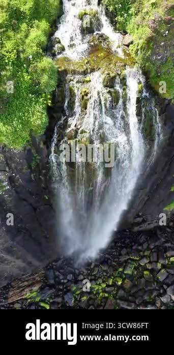 Experience the breathtaking beauty of a waterfall on the Isle of Skye ...