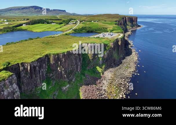 Experience an aerial view of the rugged cliffs and vibrant greenery of ...