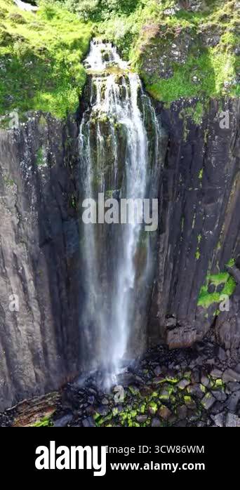 Experience the beauty of a majestic waterfall tumbling down rugged ...
