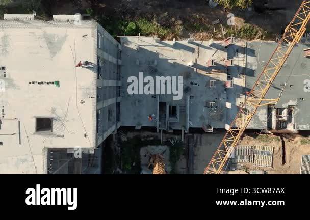 Aerial Top view of construction site with workers on reinforced ...
