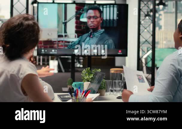 Recruiters team and male candidate engage in a video call discussion ...