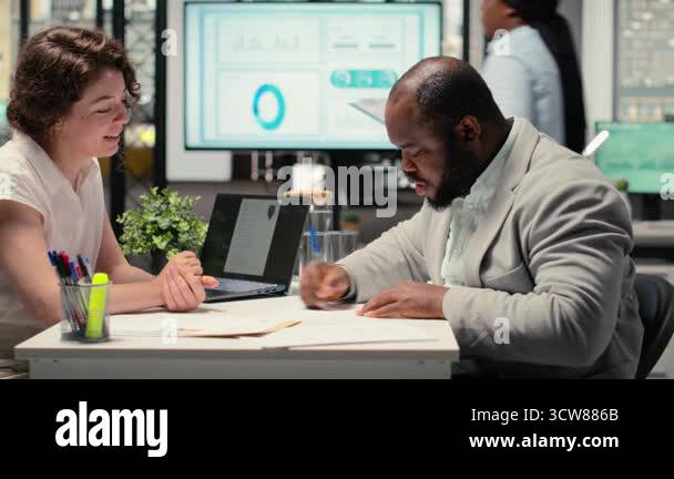 Male job applicant signing the new work contract after being accepted ...