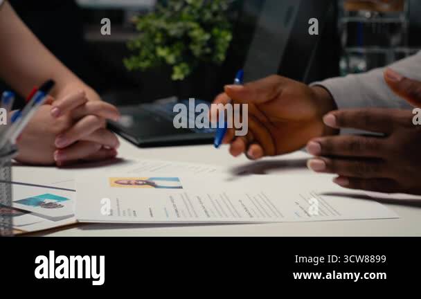 Close up of a CV resume on the table during detailed job interview with ...