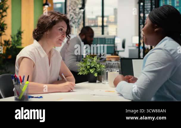 Professional candidate fills out onboarding documents and signs ...