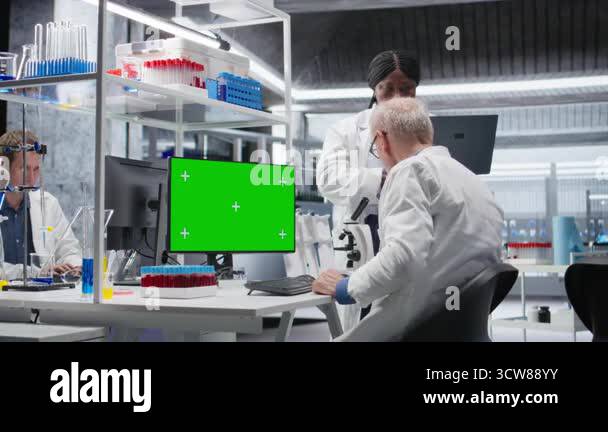 Isolated mockup on monitor next to diverse team in chemistry lab ...