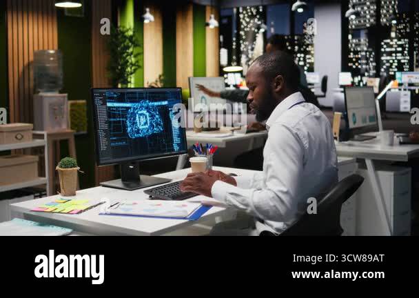 Black man analyst uses AI neural networks for data mining and optimization, working in a ...