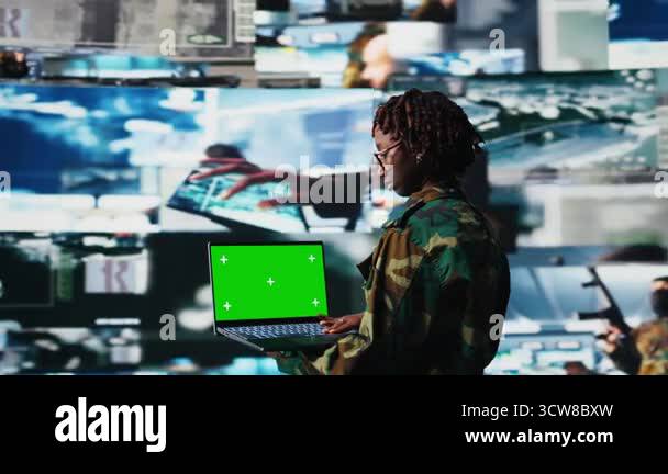 Air defense commander using radar systems on green screen mockup laptop ...
