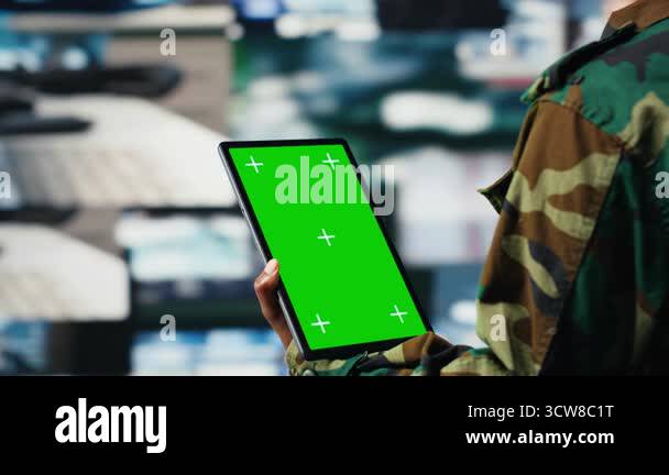 Isolated screen tablet app used by soldier in war room to operate CCTV ...