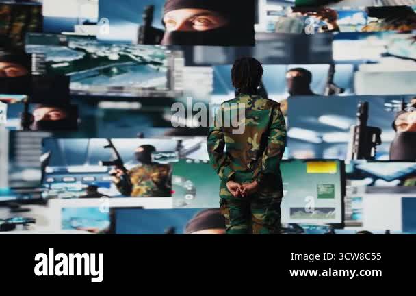 Air defense command operator using radar systems on digital videowall ...