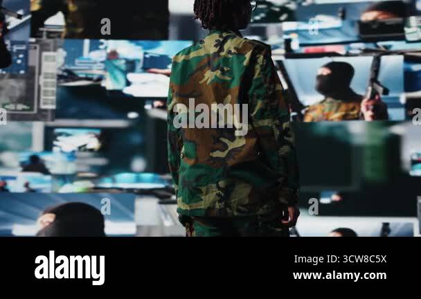 Military officer in war room oversees mission operations on digital ...