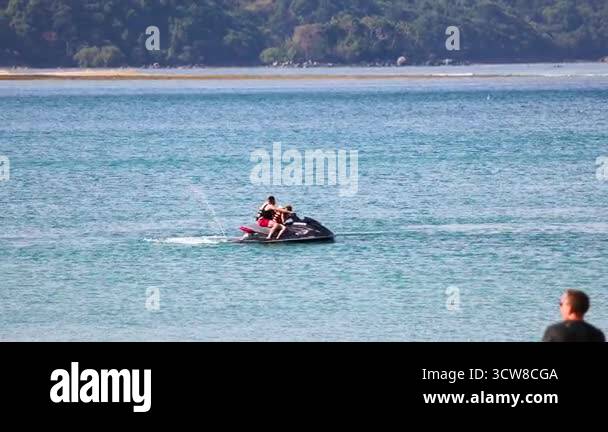 Couple enjoying a jet ski ride together Stock Video Footage - Alamy