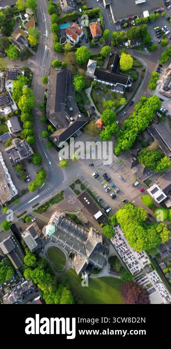 Aerial view of a town block with a central plaza, multi story buildings ...