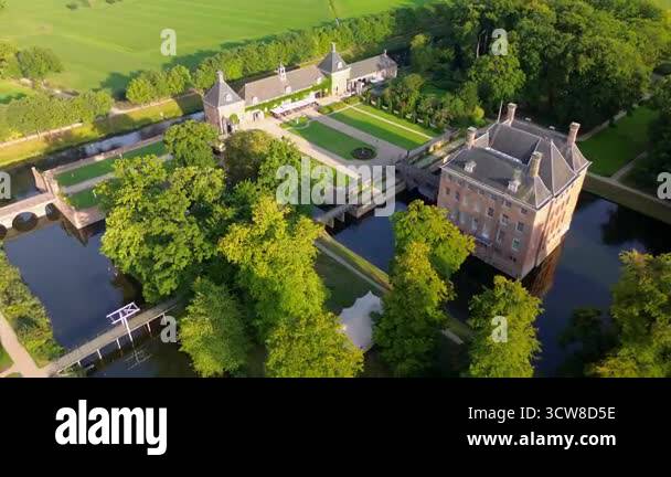 Aerial view of a historic castle on a moat surrounded island, with ...