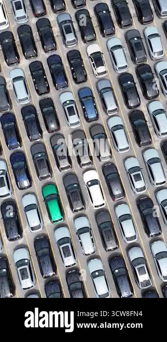 A diverse and colorful array of parked cars captured from above ...