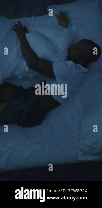 At Night, Tired Man Lies in White Bed, Moving Uneasily in Sleep ...