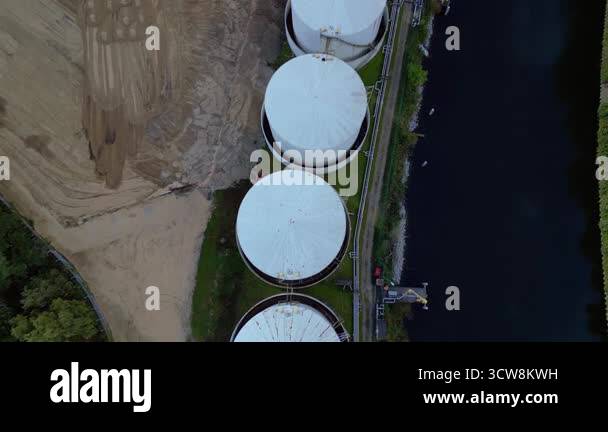 birds eye view drone of a Industrial storage tanks holding oil and gas ...