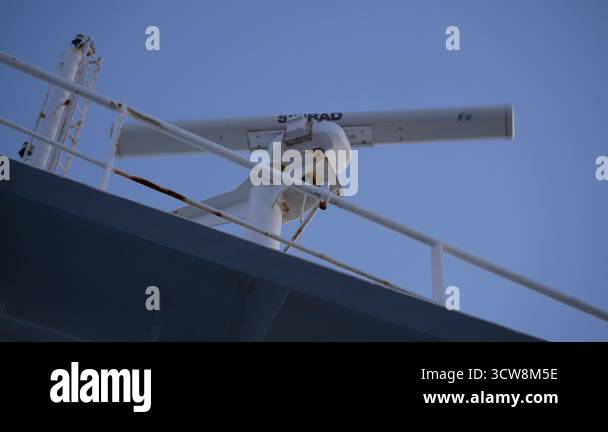 Ship radar antenna mounted on vessel deck against clear blue sky Stock ...
