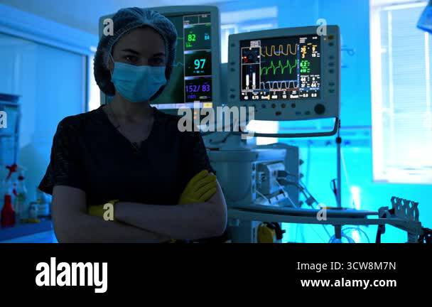 Confident female medic uniformed in cap, bask, gloves and robe stands ...