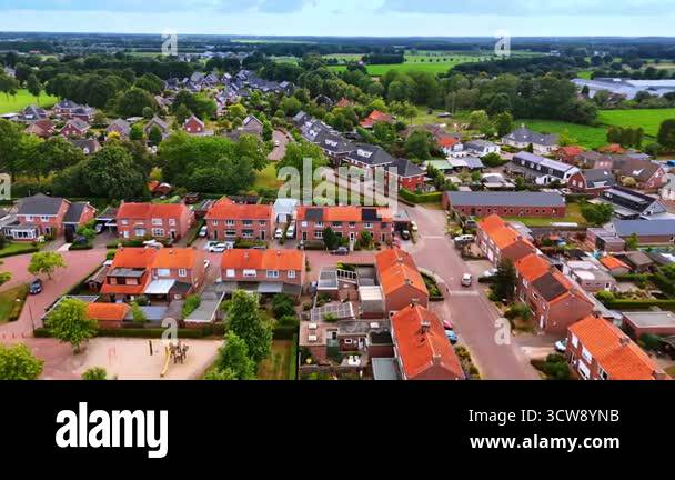 Bright suburban scene, afternoon. Aerial view of a vibrant suburb with ...