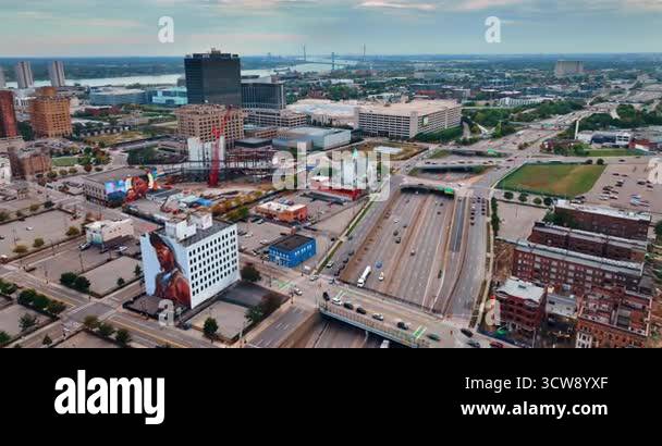 Transport moves by the multi-lane highway with multiple bridges above ...