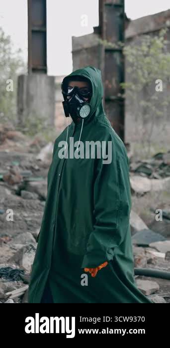 Man in special suit going out in abandoned creepy place. Apocalyptic ...
