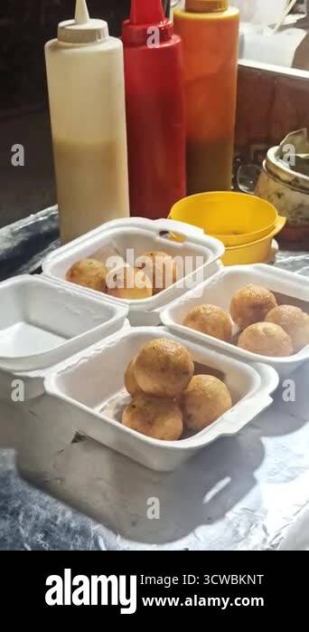 Popular Japanese street food takoyaki, delicious octopus balls topped ...