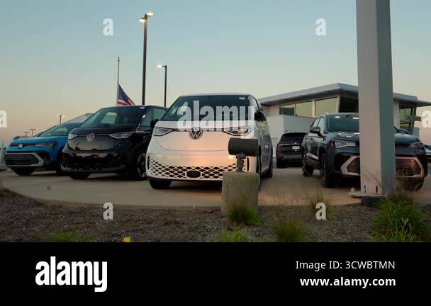 Volkswagen ID Buzz at dealership parking on twilight blue sky ...