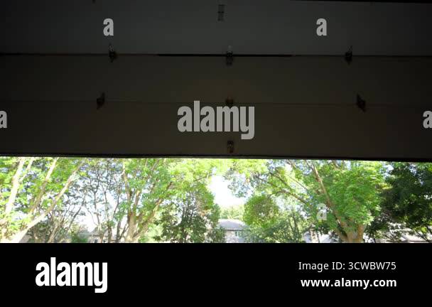 Automated garage Door opens and closes. View from inside of the ...