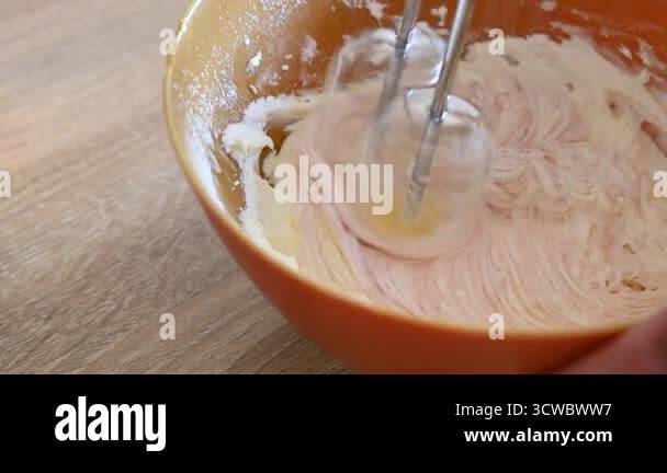 Mixing Buttercream Frosting with Food Coloring Stock Video Footage - Alamy