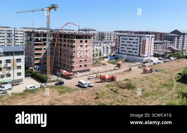 Bucharest - Romania - 2 July 2025. Aerial View of Concrete Mixer Trucks Arriving at Construction ...