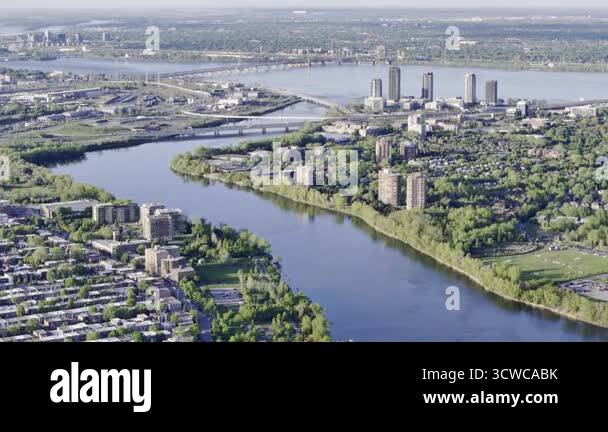 Nuns Island residential buildings, bridge, and traffic at the sunset ...