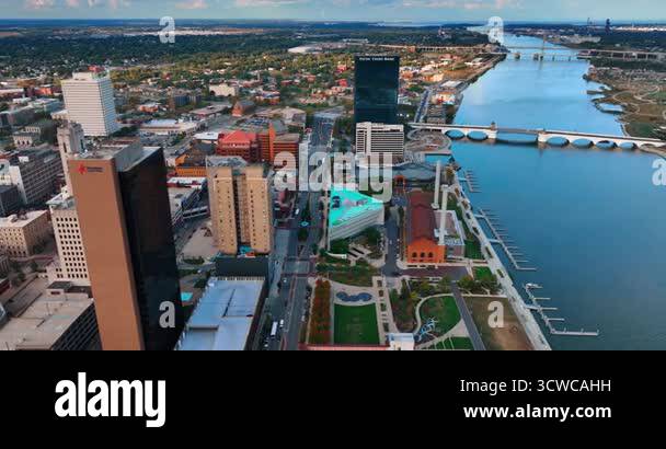 Urban waterfront of the Maumee River in Toledo, Ohio, USA. Green vast ...