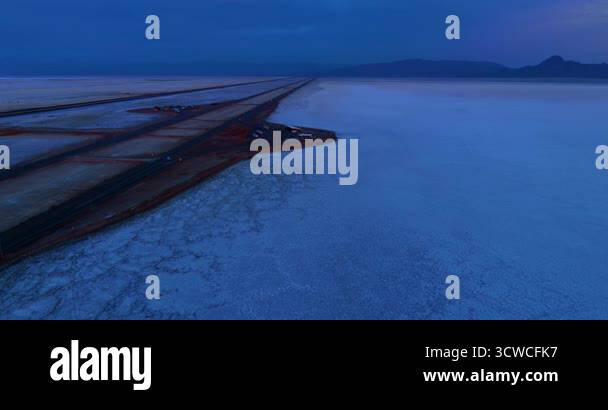 Highways and gas stations in the vast salt valley. Blue scenery of the ...