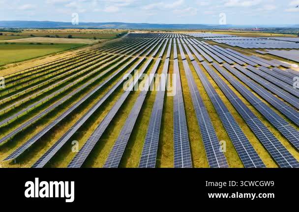 Expansive solar field installation. Massive lines of solar panels ...