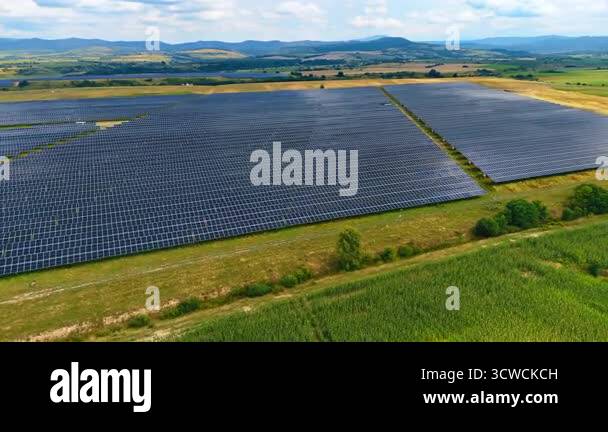 Modern solar energy plant. Expansive solar panels generating ...