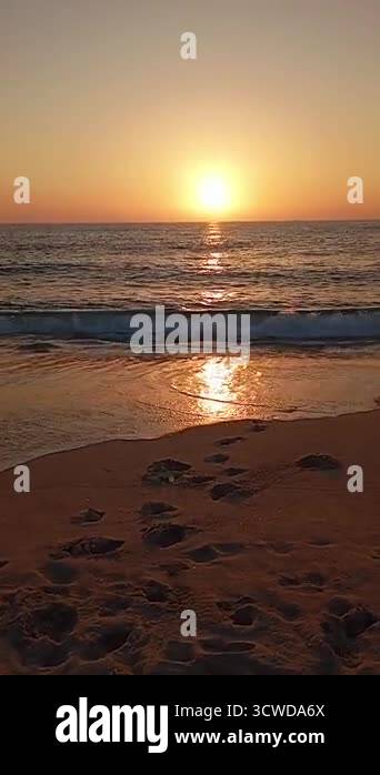 Stunning sunset over the sea with golden sunlight reflecting on ocean ...