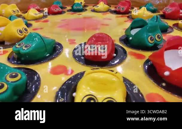 A vibrant spinning pool fishing arcade game featuring colorful plastic ...