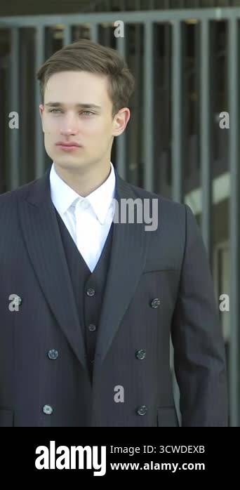 A dynamic trio of smiling business professionals, dressed in sharp ...