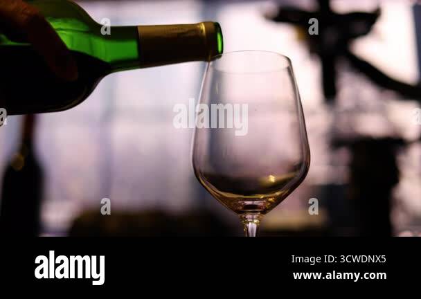 Red Wine Being Poured In Rainy Atmosphere, Red wine flows gracefully ...