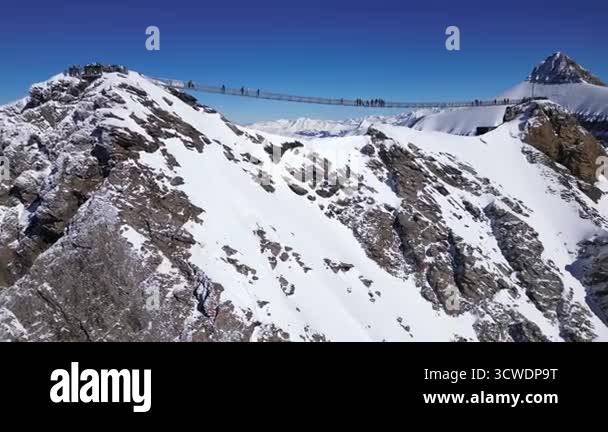 People Walking Across the Suspension Bridge on Glacier 3000 with Cable ...