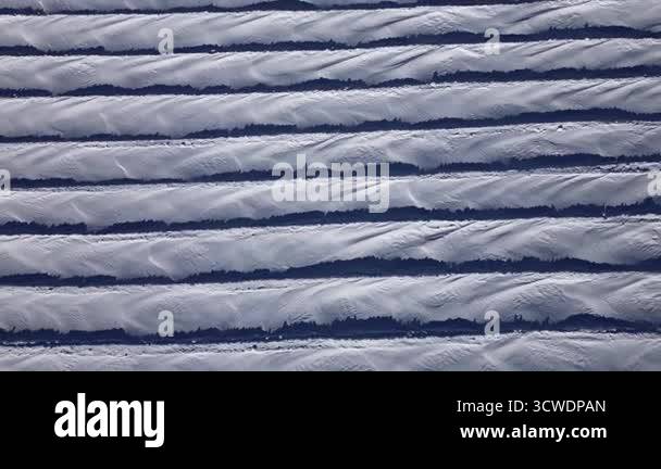 An aerial view of intricate snow formations on Glacier 3000 in the ...