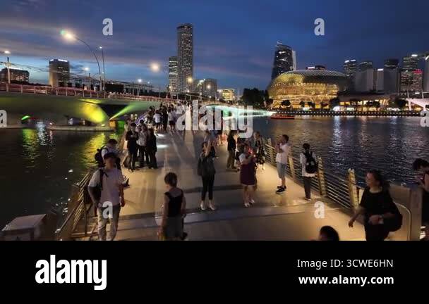 Marina Bay, Singapore - Jul 09 2024: A crowd of people are gathered on ...