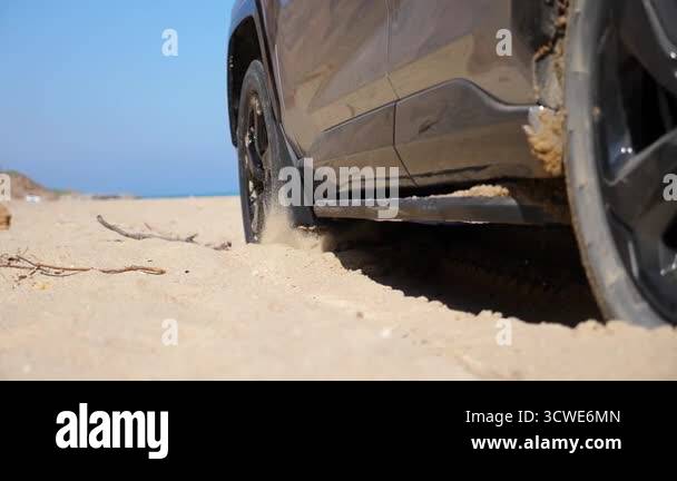 Vehicle progresses through sandy terrain, demonstrating the struggle ...